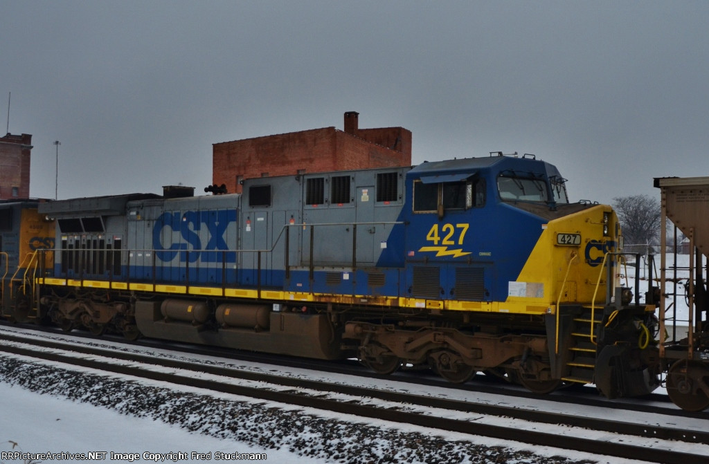 CSX 427 helps and watches the train.